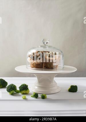 A glass dome cover on a food heating by cold smoke generator with big ...