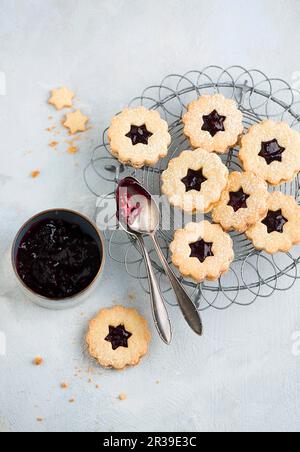 Nutty shortcrust jam sandwich biscuits Stock Photo - Alamy