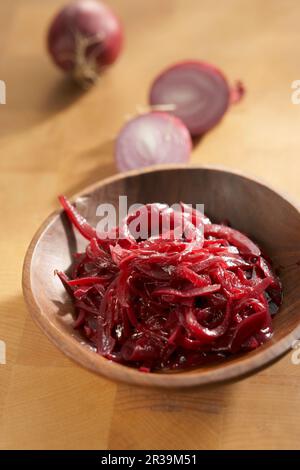 Red beet juice in a wine glass with whole beets on a wooden table Stock ...