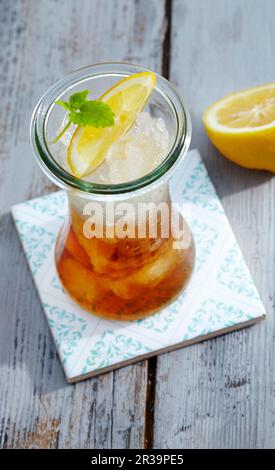 Homemade beer liqueur with corn schnapps, vanilla, crushed ice and ...