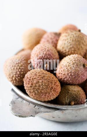 Studio shot with fruits (Lichi) of the lychee tree (Litchi chinensis ...