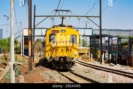 Commuter Train moving through the heart of Soweto, Johannesburg Stock ...