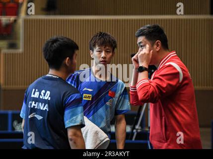 Lin Shidong from China in action against Simon Gauzy of France in the ...