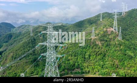 LISHUI, CHINA - MAY 23, 2023 - Workers check a power line deep in a ...