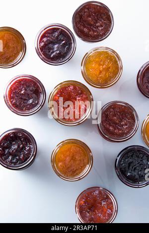 Jars of different jams on white background Stock Photo - Alamy