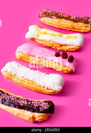 Sweet delicious colorful french eclairs. Group of french dessert ...