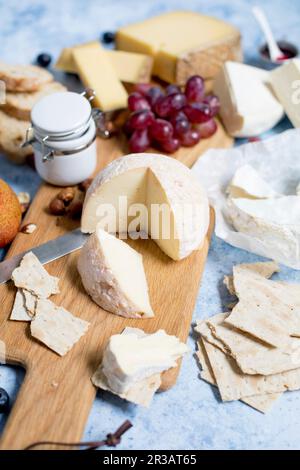 Various Processed Cheeses on Boards Stock Photo - Alamy