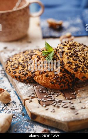 Board with cookies on black wooden background. El Dia de Muertos Stock ...