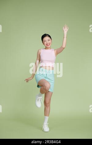 Lovely slim girl posing with sincere smile Stock Photo - Alamy
