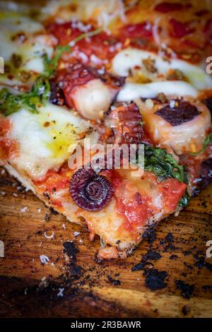 Grilled pizza with octopus Stock Photo - Alamy