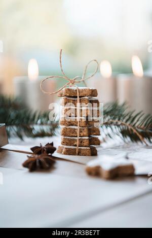 A stack of cinnamon stars tied with string Stock Photo - Alamy