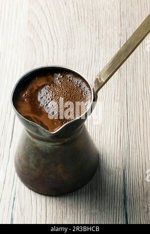 Greek coffee served with traditional greek coffee pots (Briki) and ...