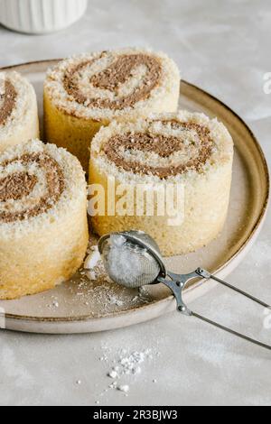 Mini Roll Cake with Vanilla Cream, Coconut and Powdered Sugar. Dessert ...