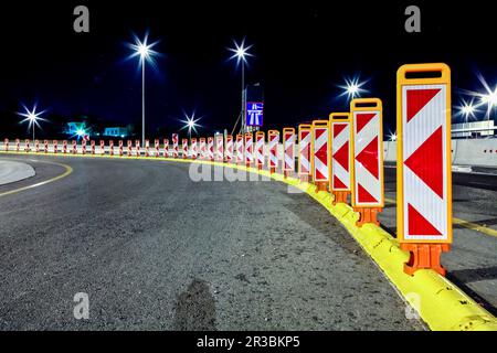 Motorway Signs and reflectors on Highway at night Stock Photo - Alamy