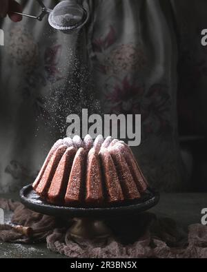 Beetroot cake dusted with icing sugar, sliced Stock Photo - Alamy