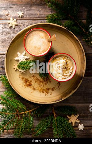 Pumpkin smoothie with spices on a wooden background Top view. Copy ...