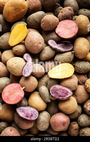 Various types of potatoes and potato colors on a stall at a food ...