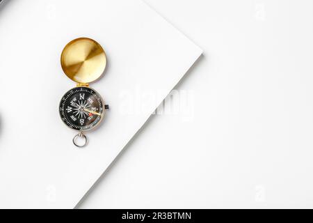 Nautical compass and empty magazine pages with copy space Stock Photo ...