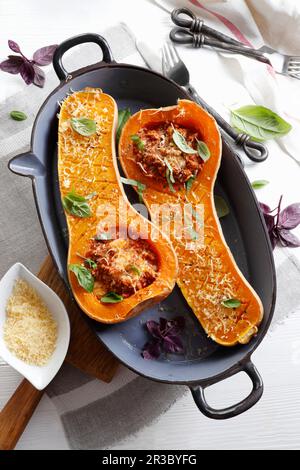 Pumpkin stuffed minced meat, vegetables and quinoa. Autumn traditional ...