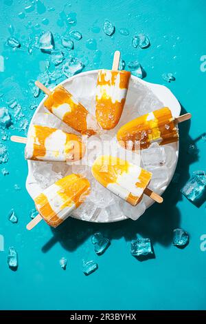 Homemade ice cream from mango and passion fruit. Popsicle Stock Photo ...