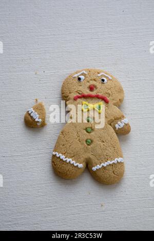 Directly above view of sad man lying down in fetal position on carpet ...