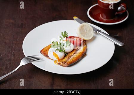 kipper(smoked herring) and poached egg, traditional British breakfast ...