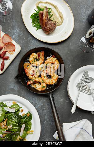 Top view of set of lamb dishes Stock Photo - Alamy