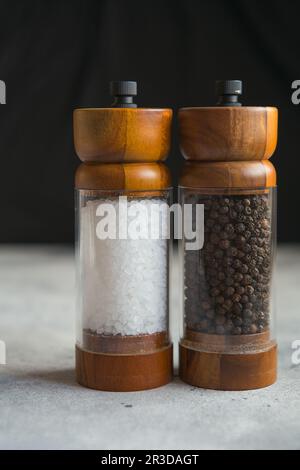 Wooden salt mill and pepper grinder kitchen tools Stock Photo - Alamy
