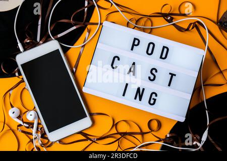 Podcasting lettering and vinyl record album audio cassette tape on ...