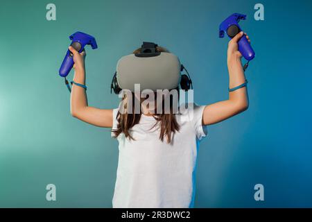 Teenager girl using a gaming gadget for virtual reality. Augmented ...