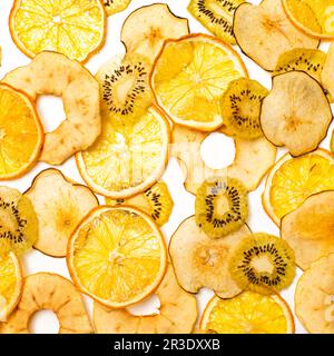 Set of different pieces fresh fruits in glass Stock Photo - Alamy