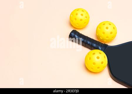 Beige pickleball racket and ball on beige background. Horizontal ...