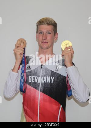 Gold medalist Florian Wellbrock of Germany poses on the podium after ...