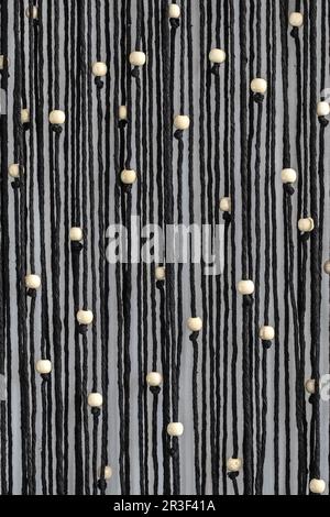 Black strings with beads Stock Photo - Alamy