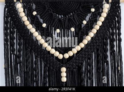 Black macrame with beads Stock Photo - Alamy