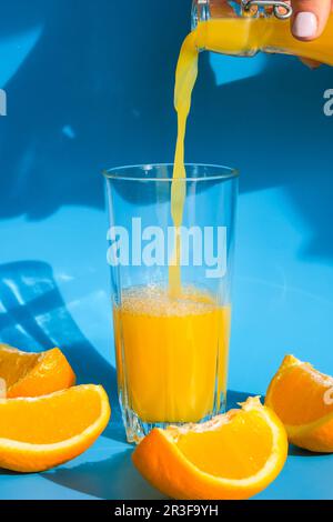 pouring orange juice with fruits isolated on a white background Stock ...