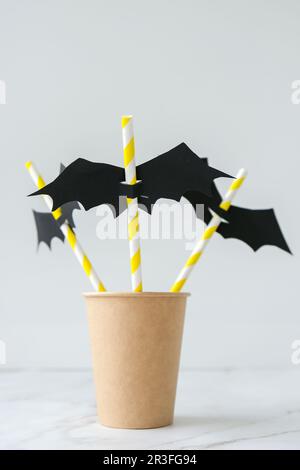 Black paper bat on drinking straw. Halloween party decoration. DIY for ...