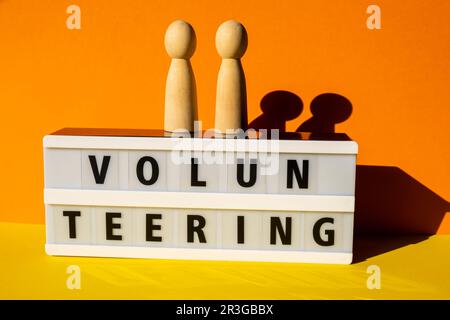 Lightbox with text VOLUNTEERING. Motivational Words Quotes Concept ...