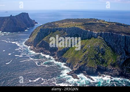 The Tasman Island Lighthouse and the cliffs of Cape Pillar Stock Photo ...