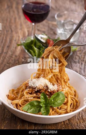 closeup of tagliatelli pasta on a wooden board Stock Photo - Alamy