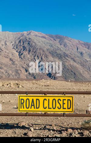 Death Valley, California. Road Closed sign in the middle of the desert ...