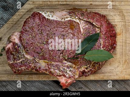 Seasoned fresh beef chop ready yum grilling Stock Photo - Alamy