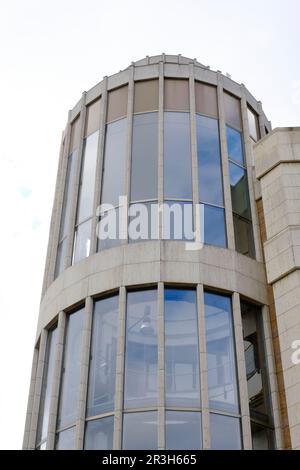 Modern round building with glass facade. Modern residential building ...