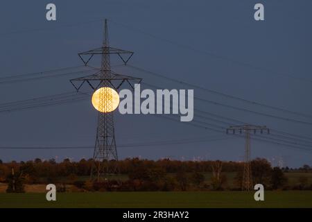 Moon with lattice mast Overhead line Stock Photo - Alamy