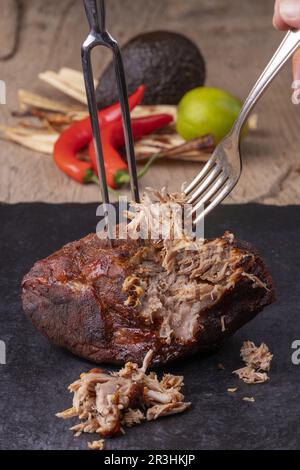 Pulled Pork of a pork shoulder roasted on a smoker Stock Photo - Alamy