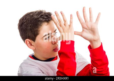 Caucasian boy thumbing his nose Stock Photo - Alamy