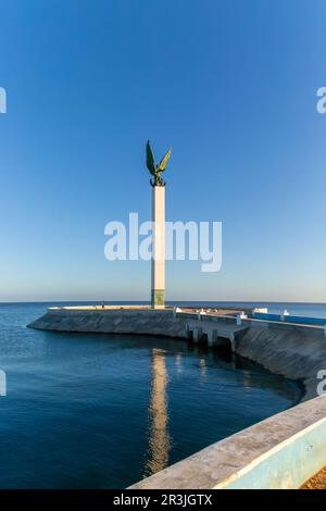 Sculpture of winged Mayan Angel on tall column, the seafront Malecon ...