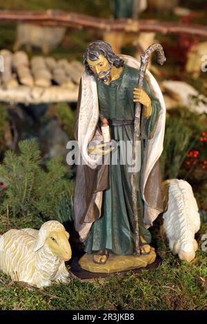 Nativity figurine, Shepherd with sheep Stock Photo - Alamy
