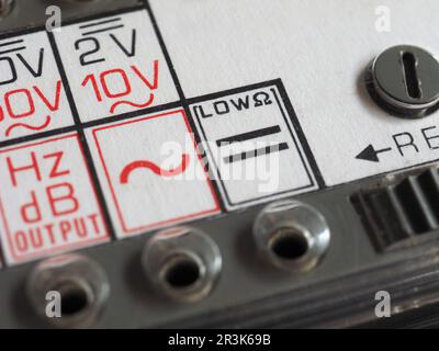 electrical symbols on a vintage analog multimeter measuring instrument ...
