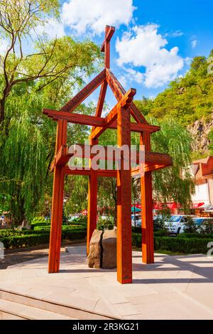 Landscape with a chapel and a water source Stock Photo - Alamy